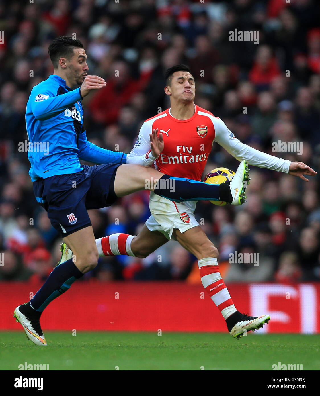Arsenal's Alexis Sanchez is tackled by Stoke City's Geoff Cameron (left ...