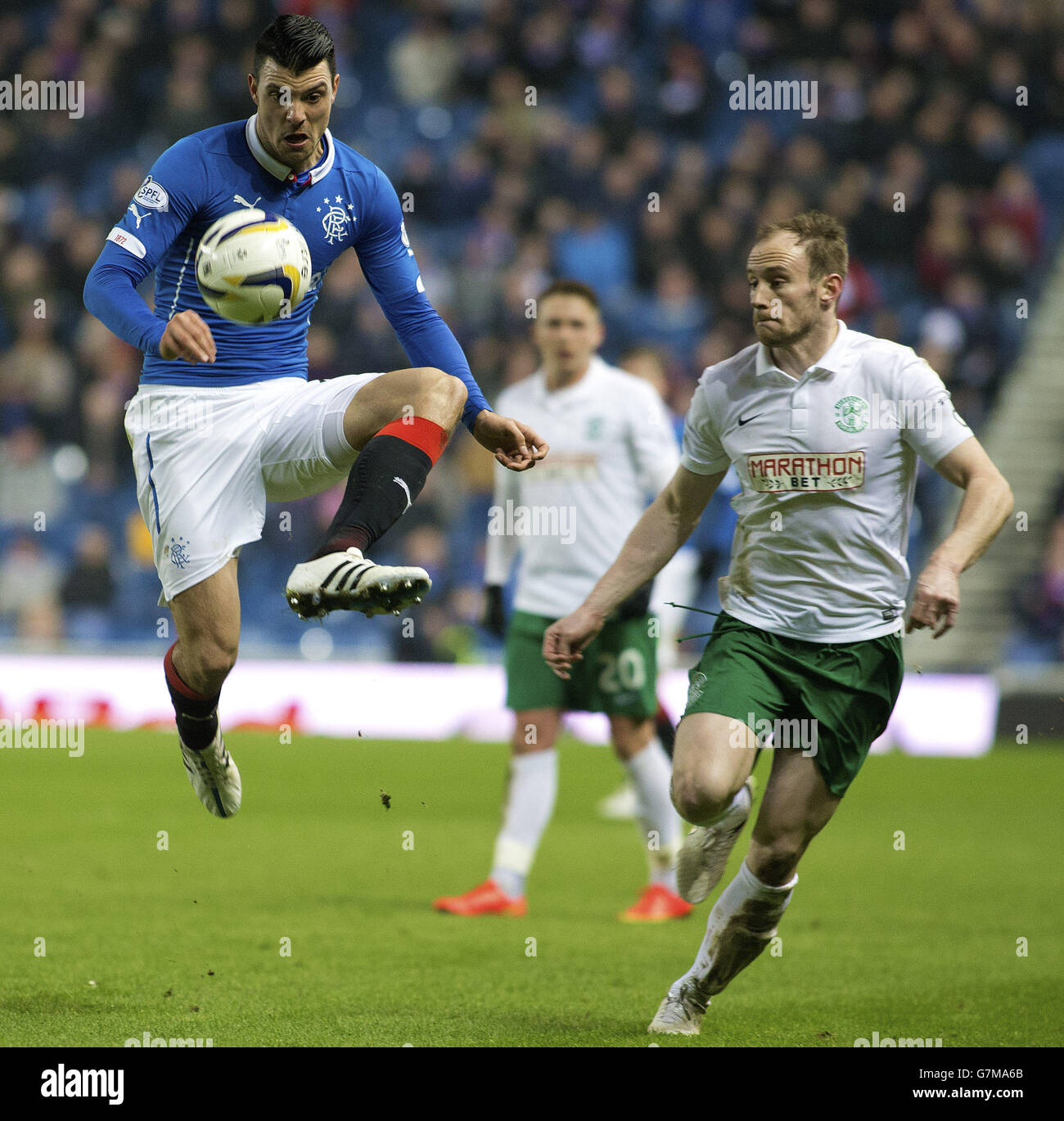 Hibernian's David Gray (right) and Rangers' Haris Vuckic (left) battle ...