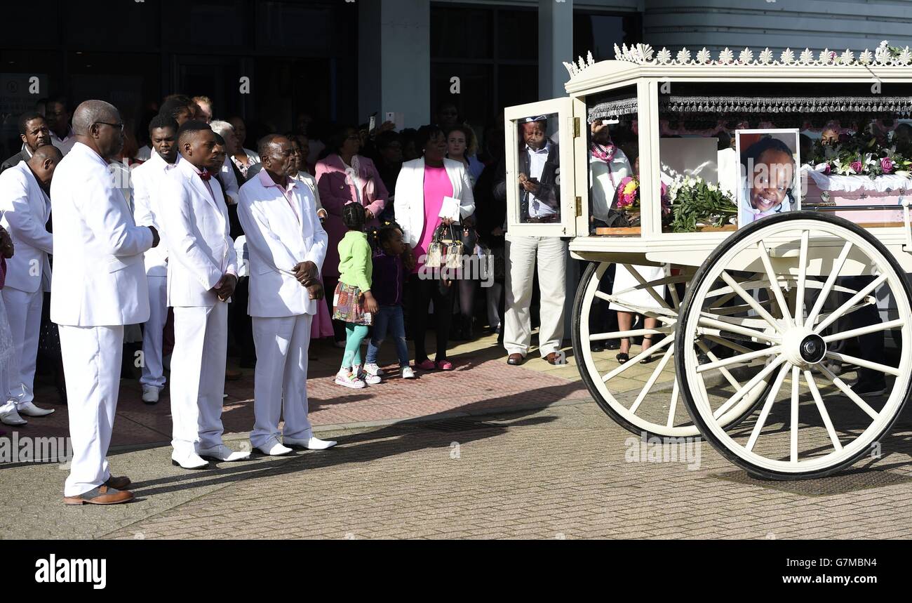 Mourners, including Stanley Bwanya (third left) the grandfather of five ...