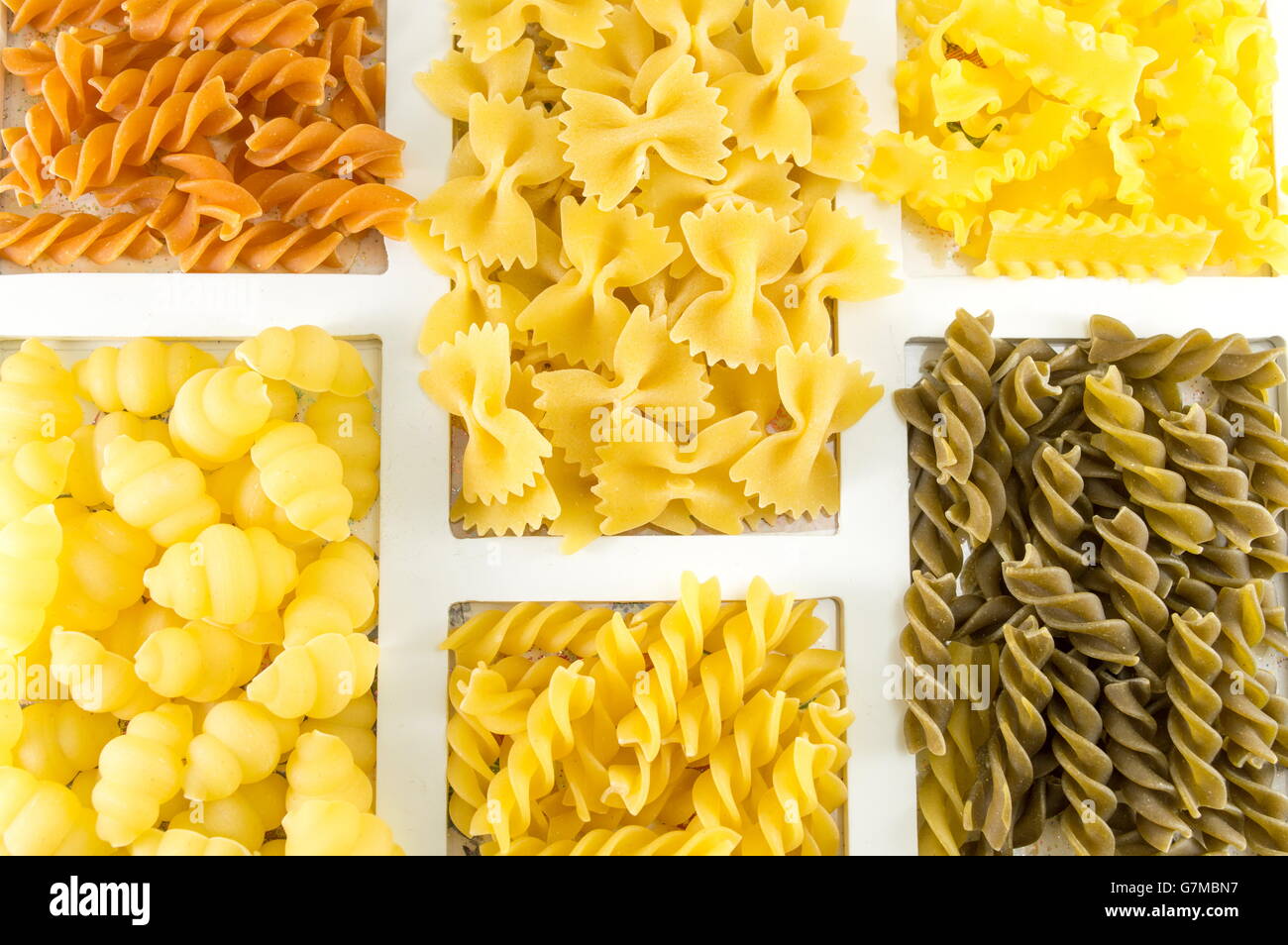 Pasta mix arranged in a white wooden frame Stock Photo - Alamy