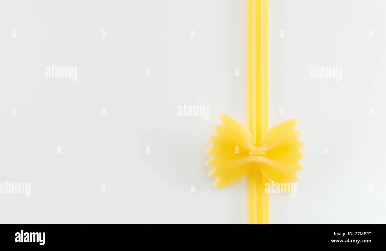 Spaghetti forming present box ribbon shape on a white background Stock ...