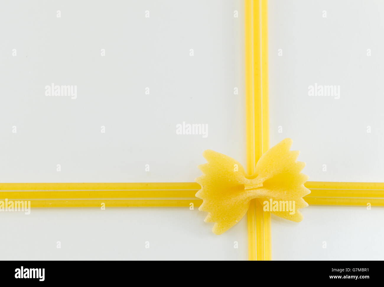 Spaghetti forming present box ribbon shape on a white background Stock ...