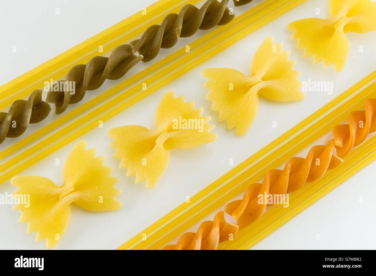 Pasta forming shapes on a white background Stock Photo - Alamy