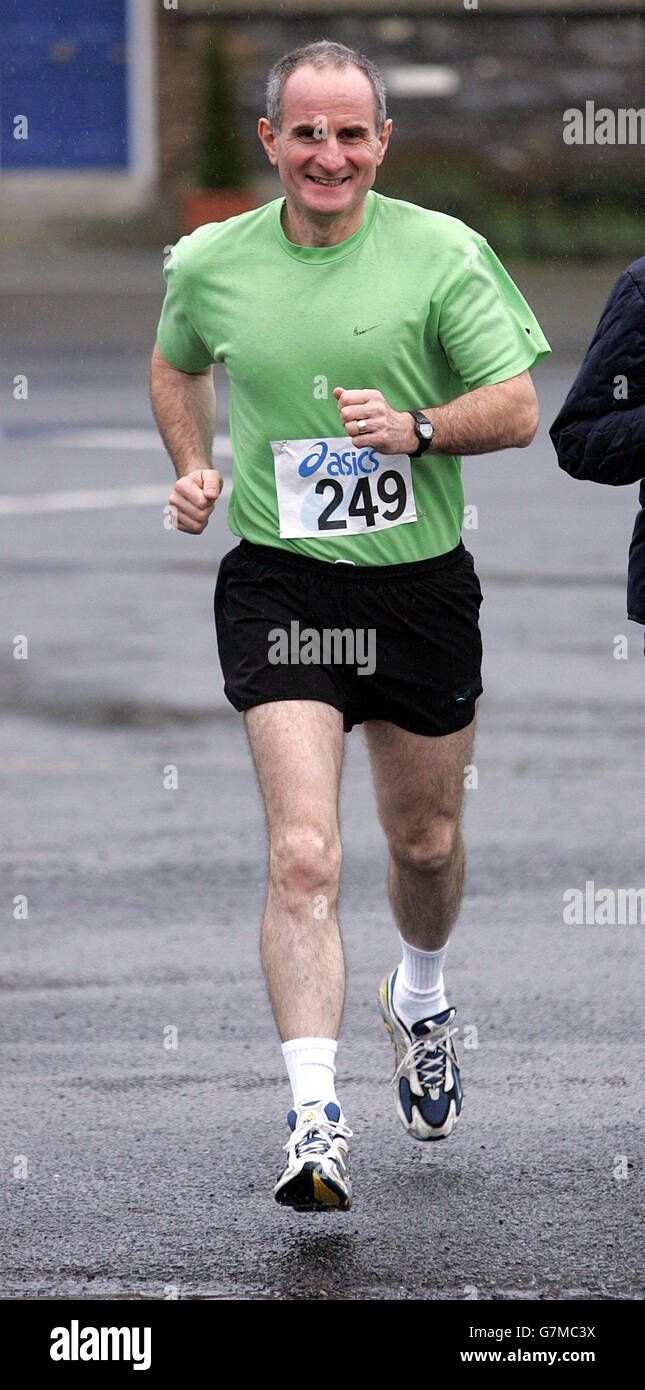 Full length competing smiling police garda hi-res stock photography and ...