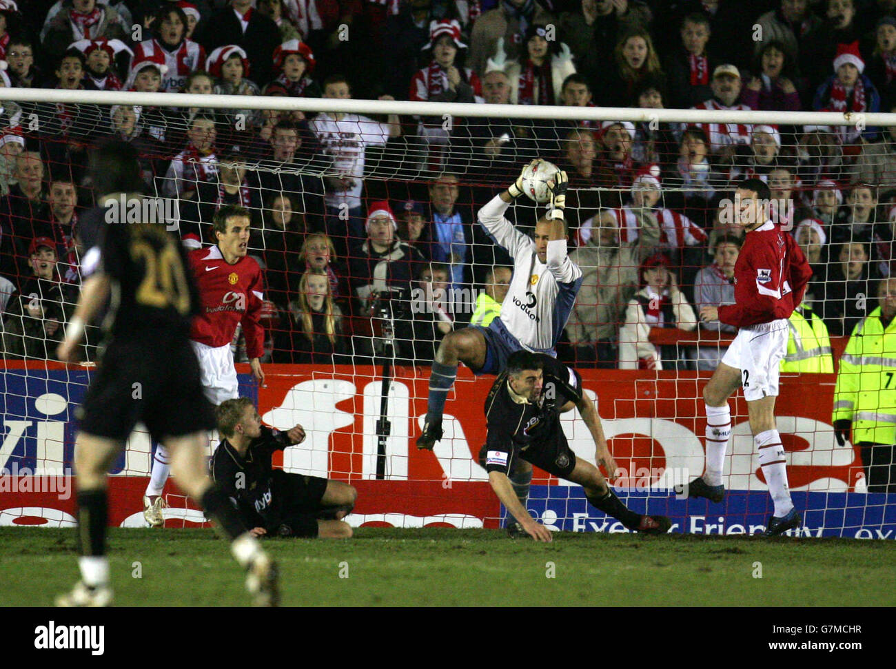 Manchester United's goalkeeper Tim Howard saves the ball under pressure ...