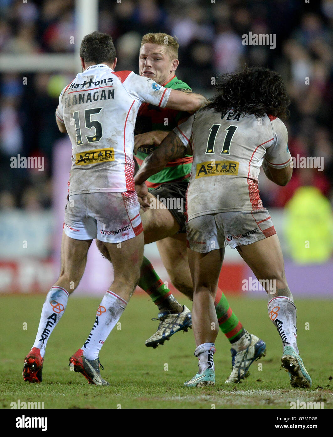 South Sydney Rabbitohs' George Burgess is tackled by St Helens' Mark ...