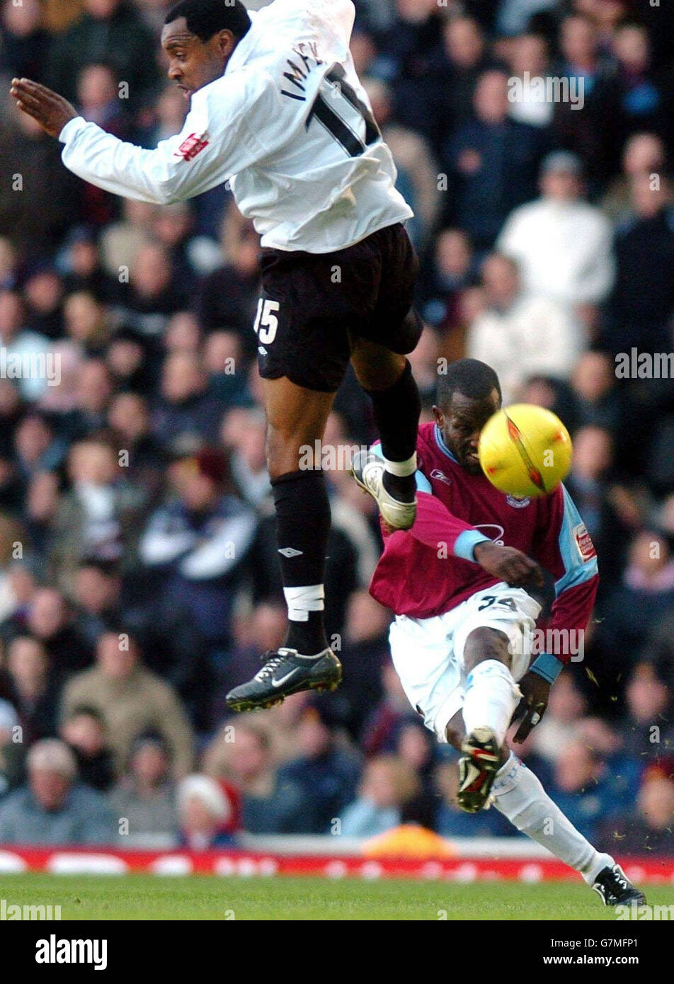 Chris Powell of West Ham United (right) clashes for the ball with ...