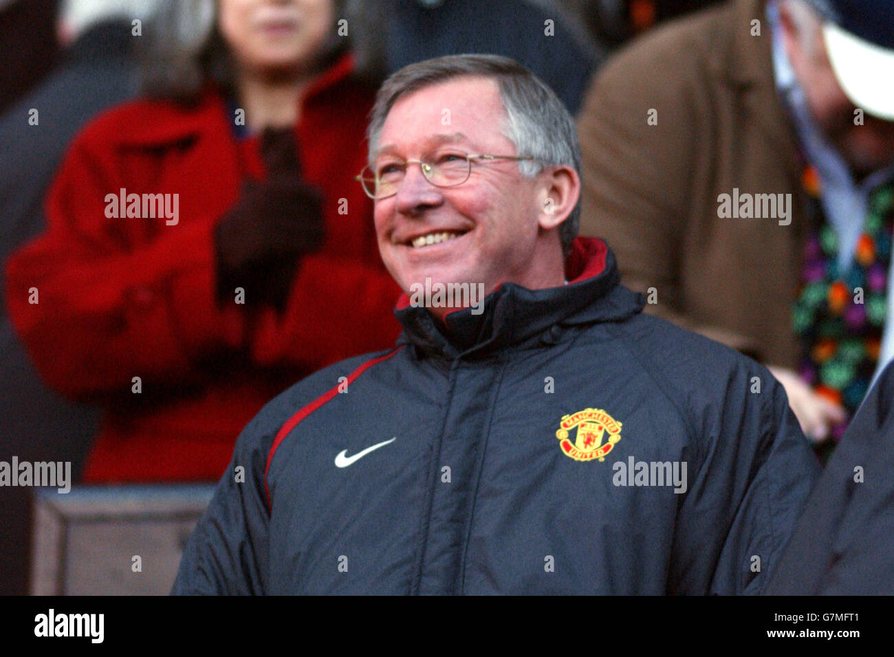 Manchester United's Manager Alex Ferguson is all smiles as his team run ...