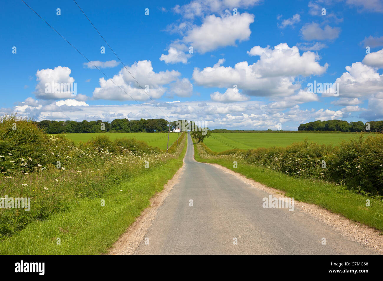 A rural highway through the beautiful farming landscape of the ...