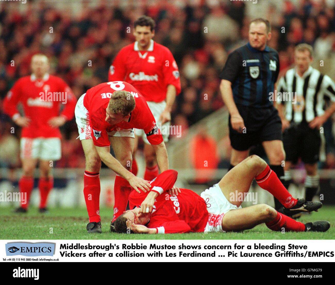 Middlesbrough's Robbie Mustoe shows concern for a bleeding Steve ...