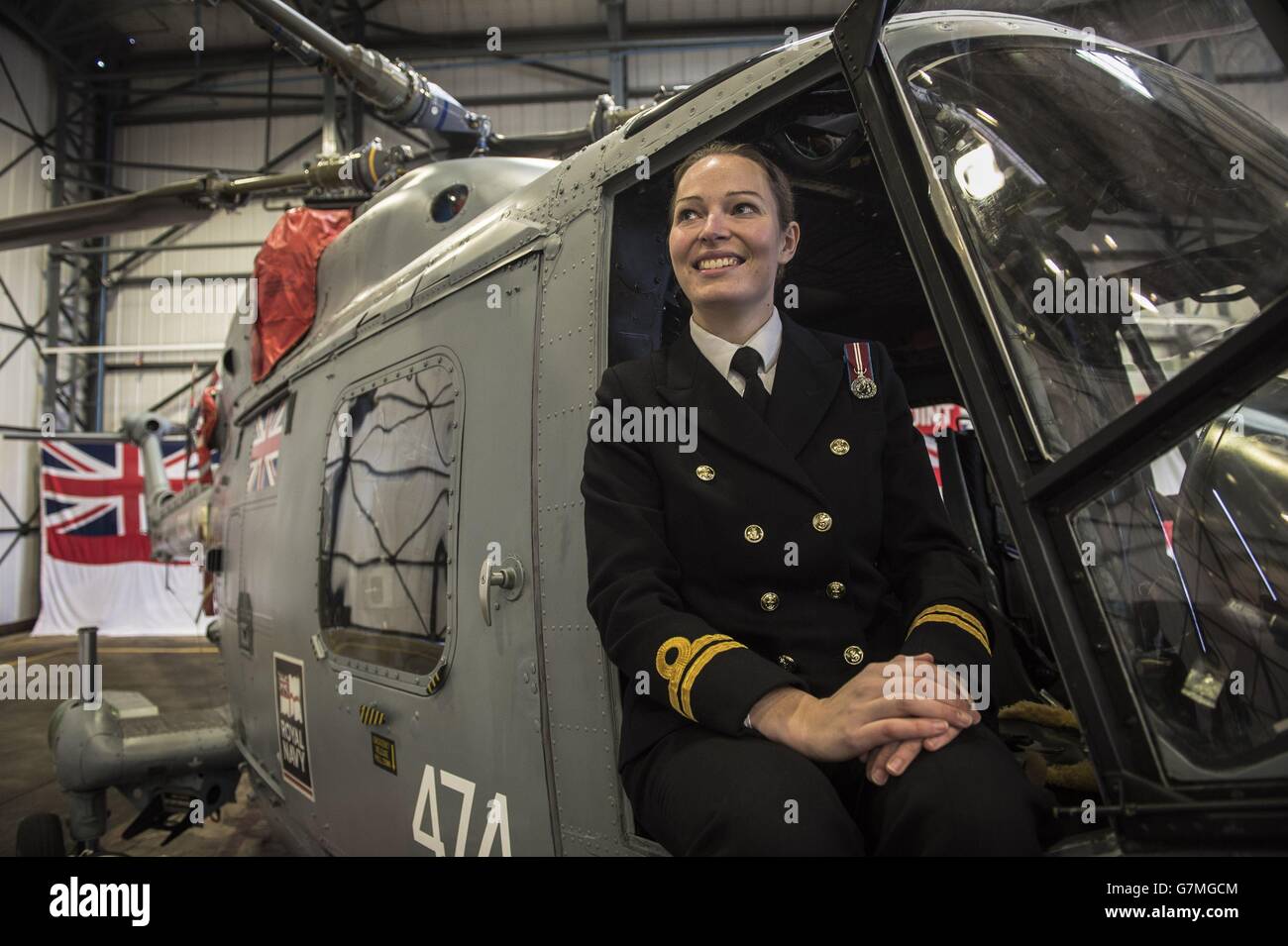 Lieutenant Danielle Welch of the Royal Navy with a Lnyx aircraft after ...
