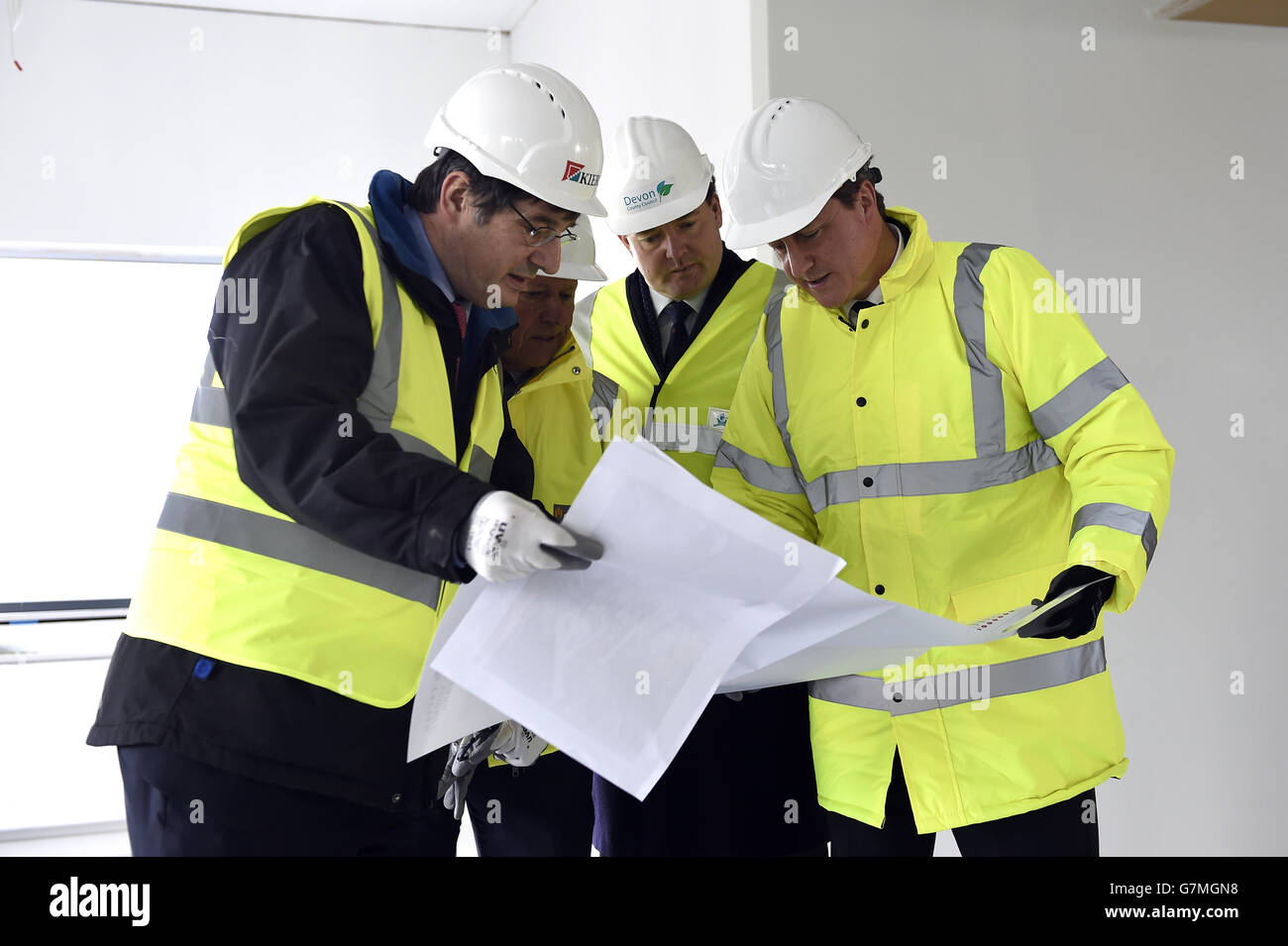 Prime Minister David Cameron looks at plans with Kier Project Manager ...