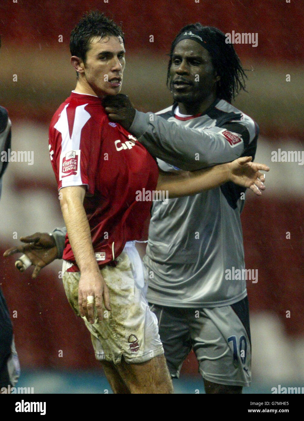 Nottingham Forest's John Thompson is grabbed around the neck by Stoke ...