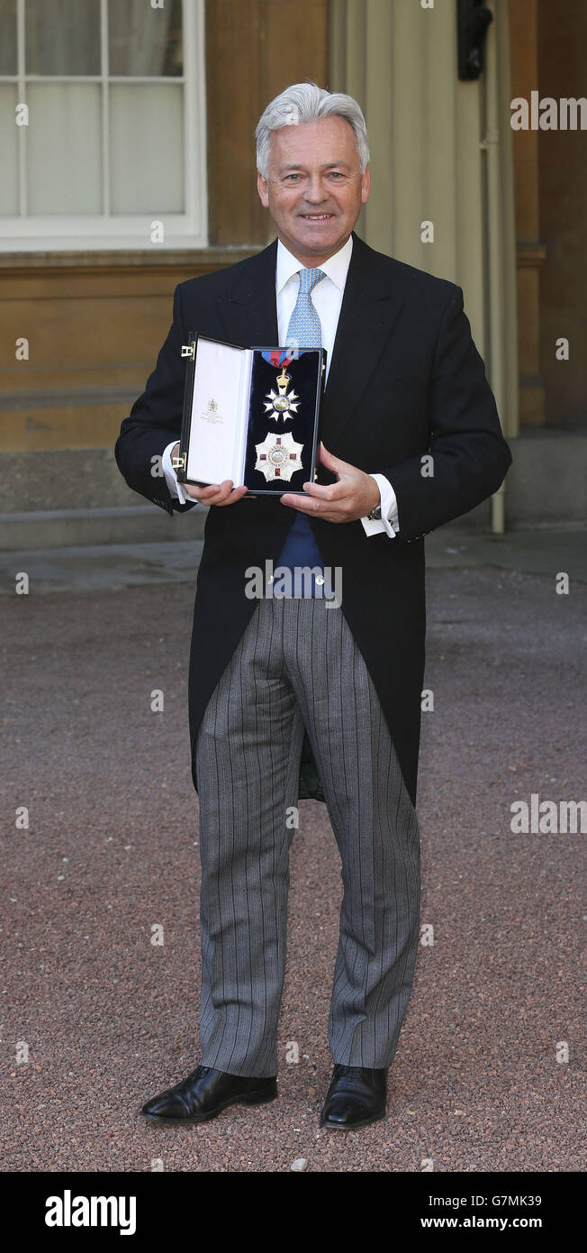 Sir Alan Duncan holding a medal presented to him by the Prince of Wales ...