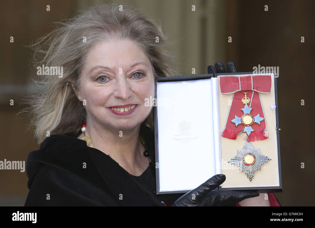 Dame Hilary Mantel holding her Dame Commander of the British Empire ...