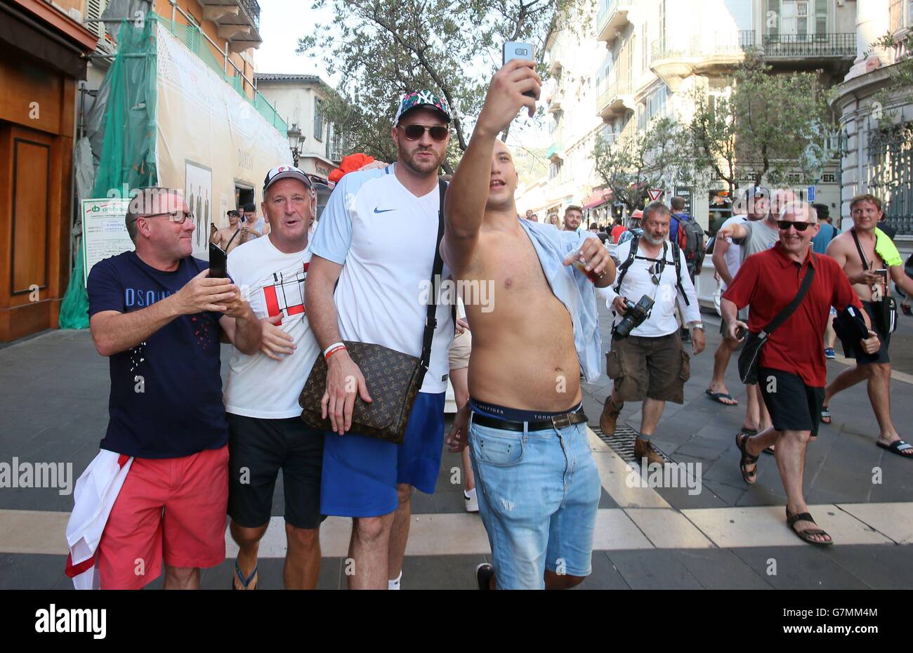Boxer Tyson Fury poses for pictures with England supporters in Nice ...