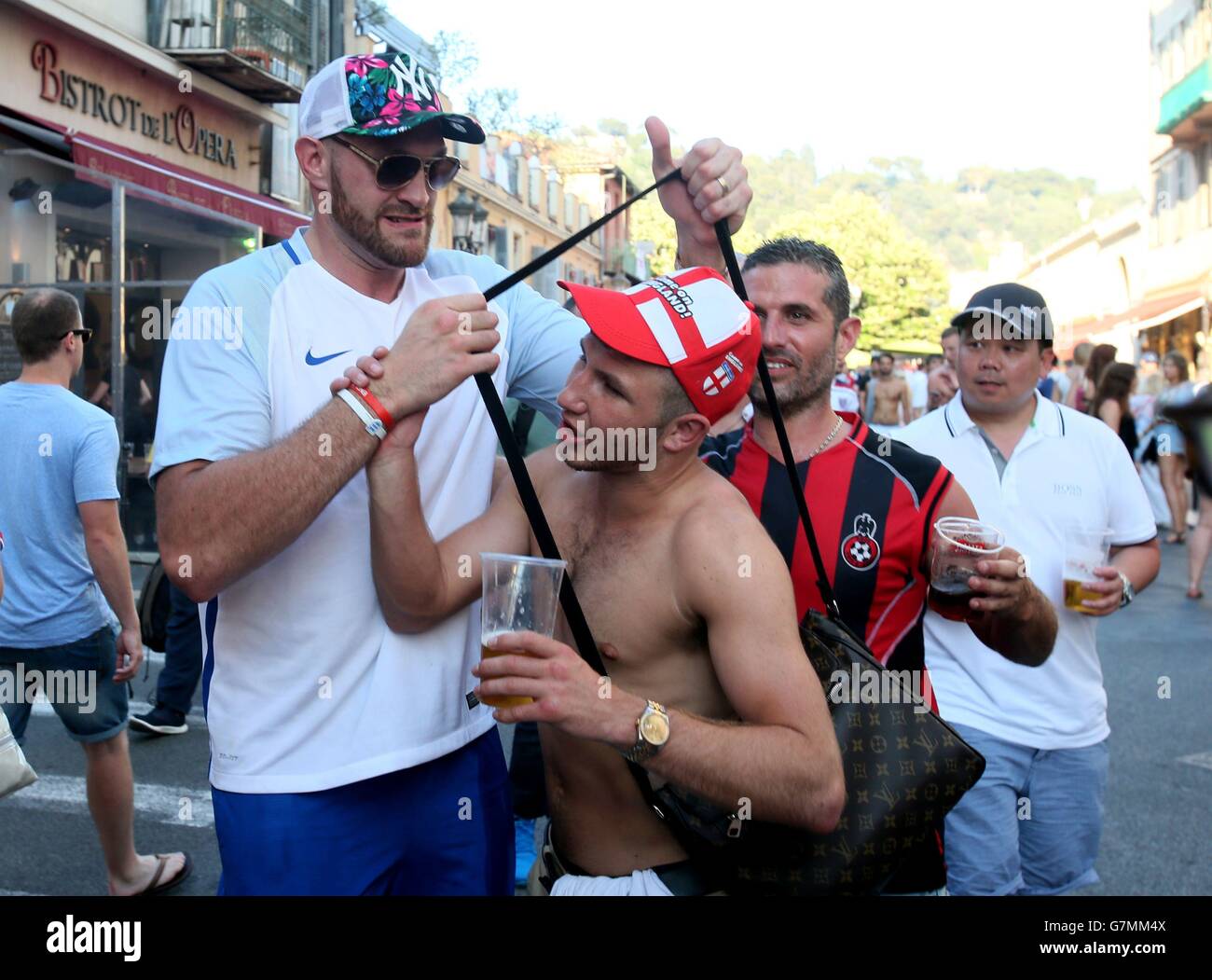 Boxer Tyson Fury (left) is greeted in the streets by England supporters ...