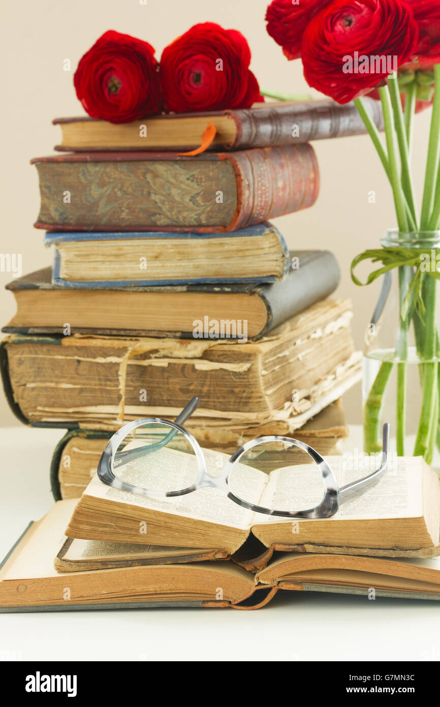 Old books with rose flower Stock Photo - Alamy