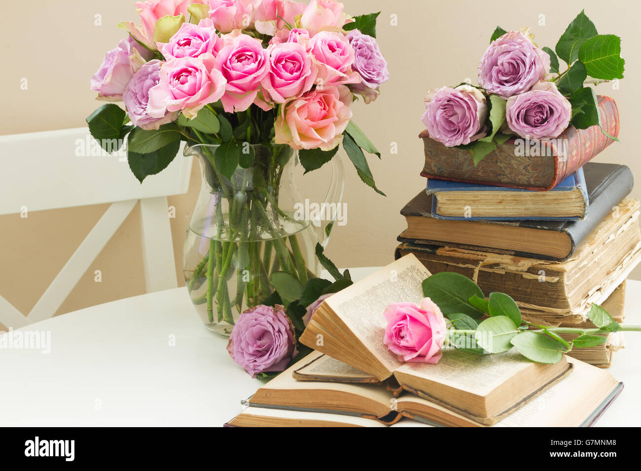 Old books with rose flower Stock Photo - Alamy