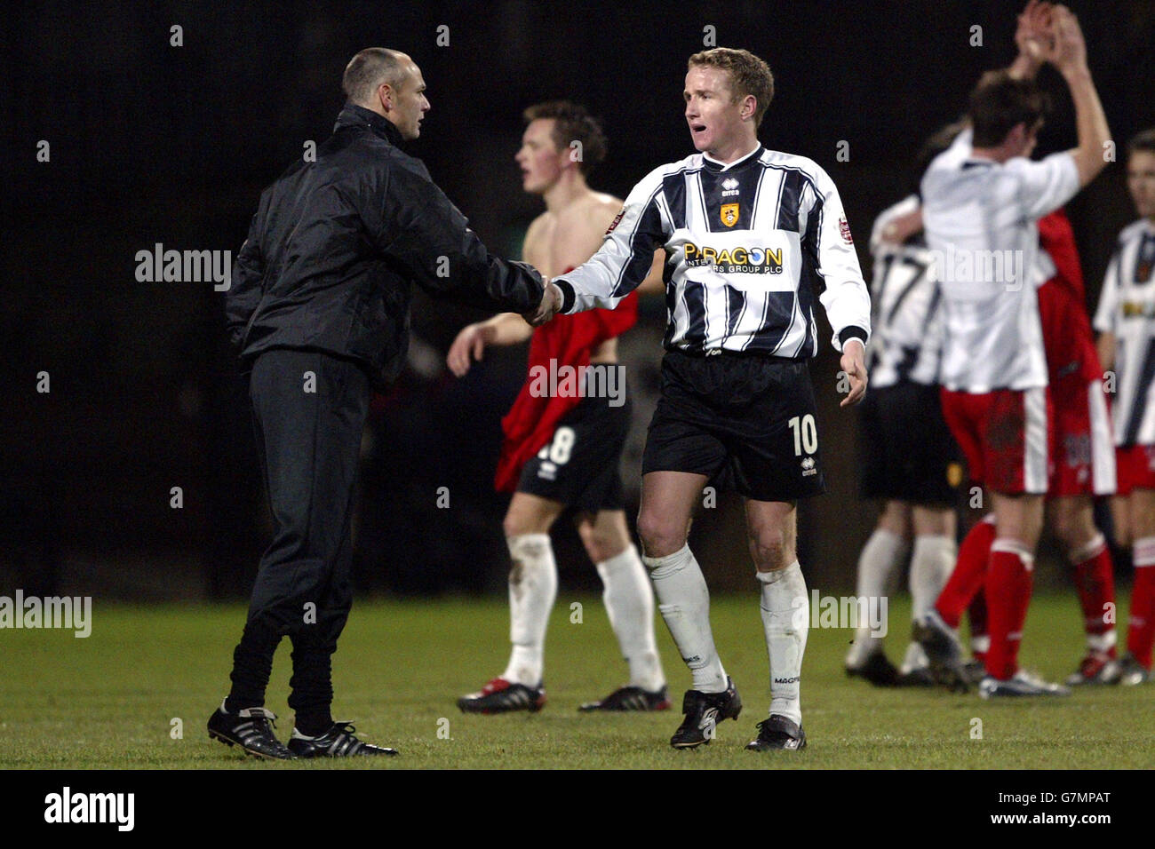 Notts County caretaker/player manager Ian Richardson (l) congratulates ...