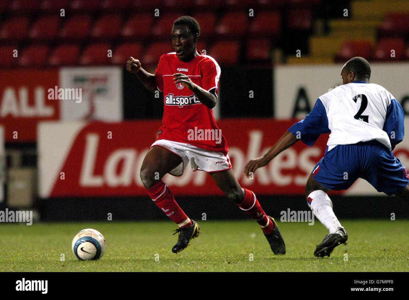 Charlton Athletic's Lloyd Sam (l) goes round Crystal Palace's Emmerson ...