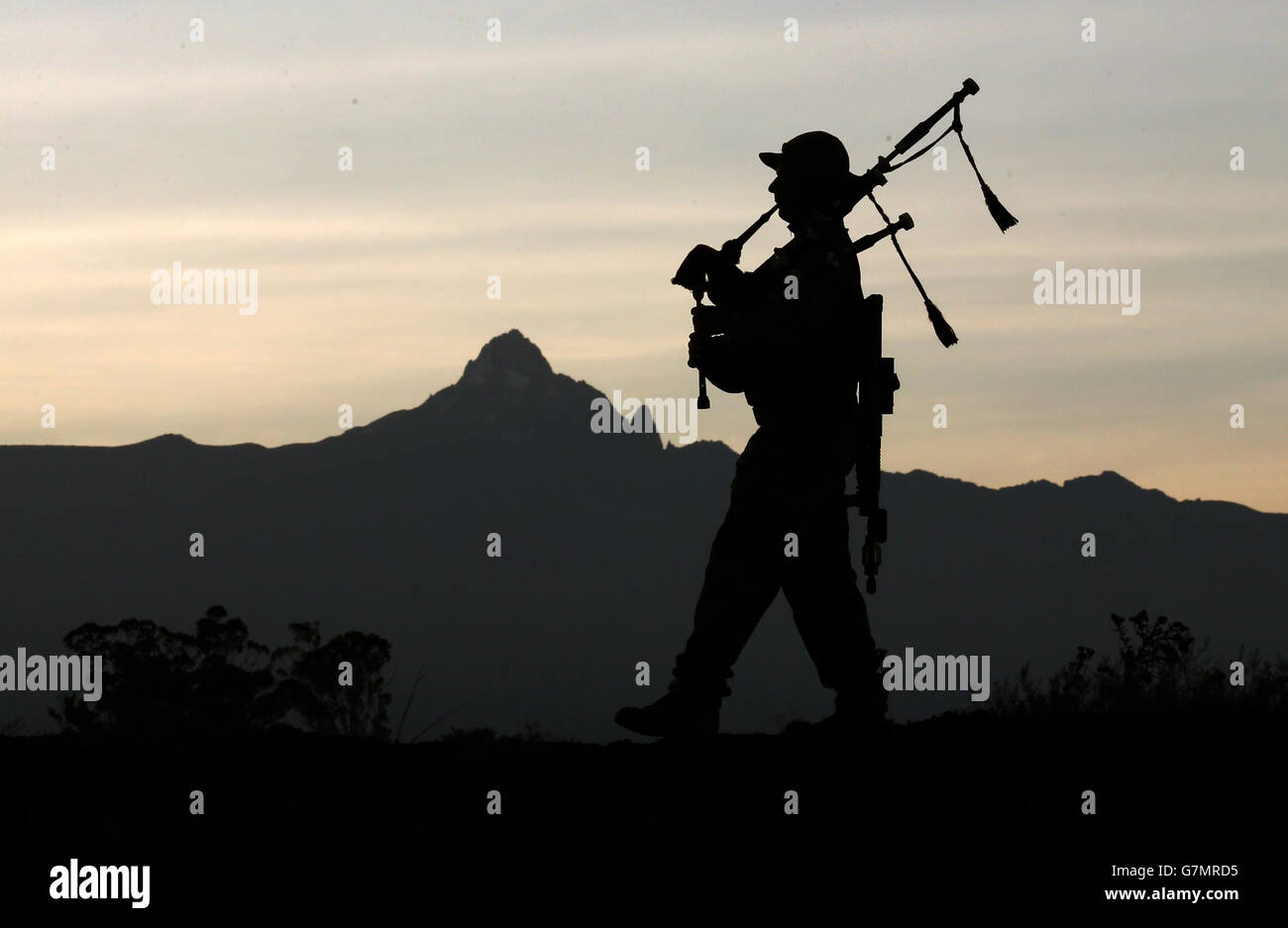 Piper Stuart Gillies from Arran plays his pipes as the sunrises over ...
