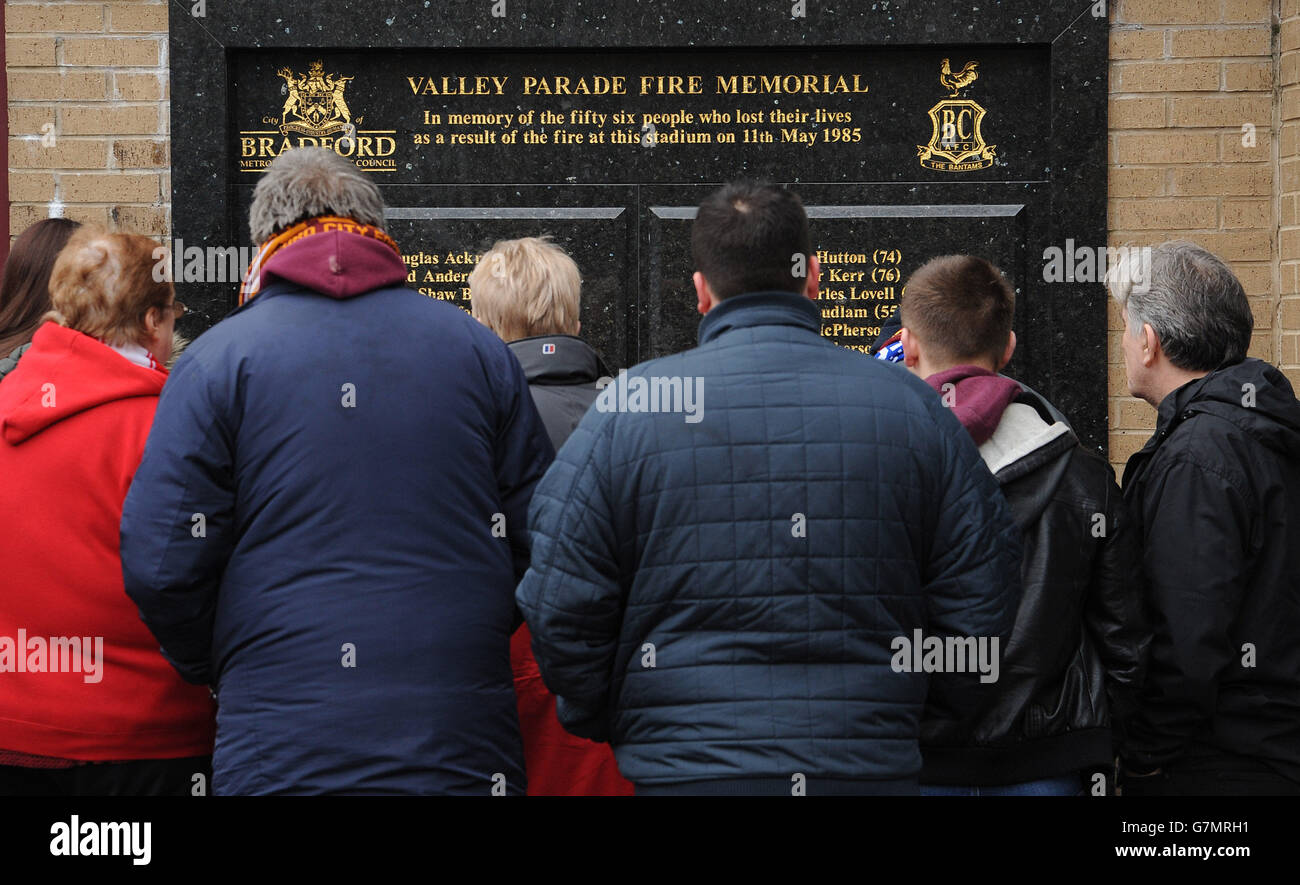Fans look at the Valley Parade Memorial ahead of the FA Cup Fifth Round ...