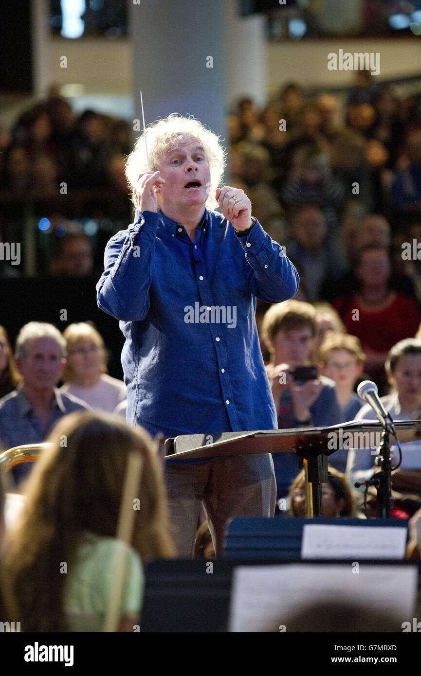 Sir Simon Rattle conducts the 100-piece Young Orchestra for London at ...