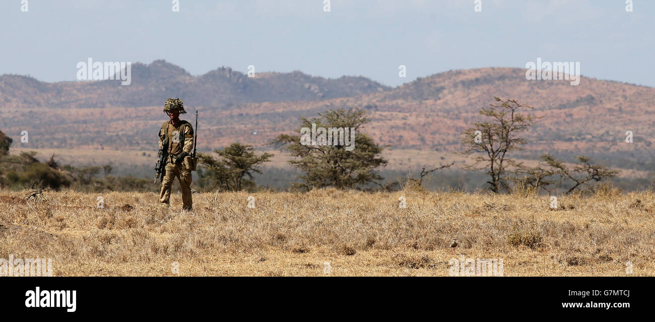 A soldier patrols as troops from the 2nd Battalion, The Royal Regiment ...