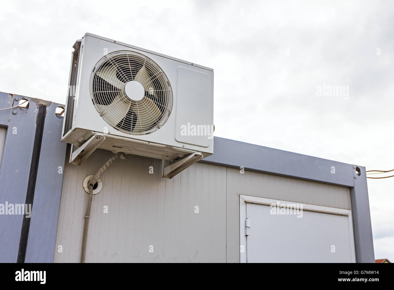 Outdoor unit, compressor, of air conditioner is placed on white ...