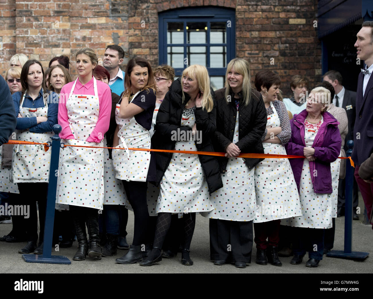 Employees await the arrival of the Duchess of Cambridge, to the Emma ...