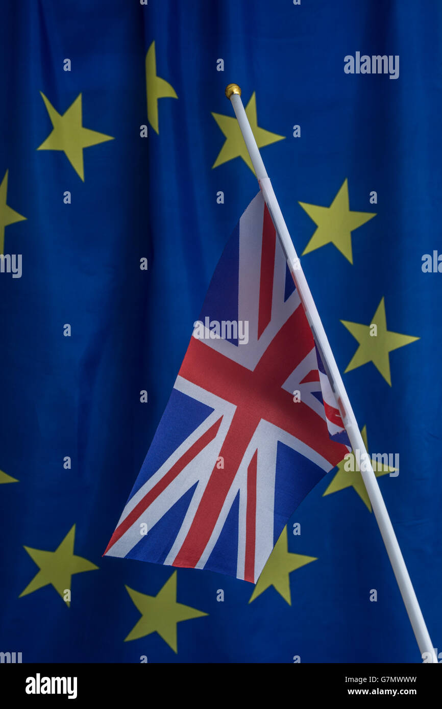 Brexit concept. Union Jack against crumpled EU European Community flag ...