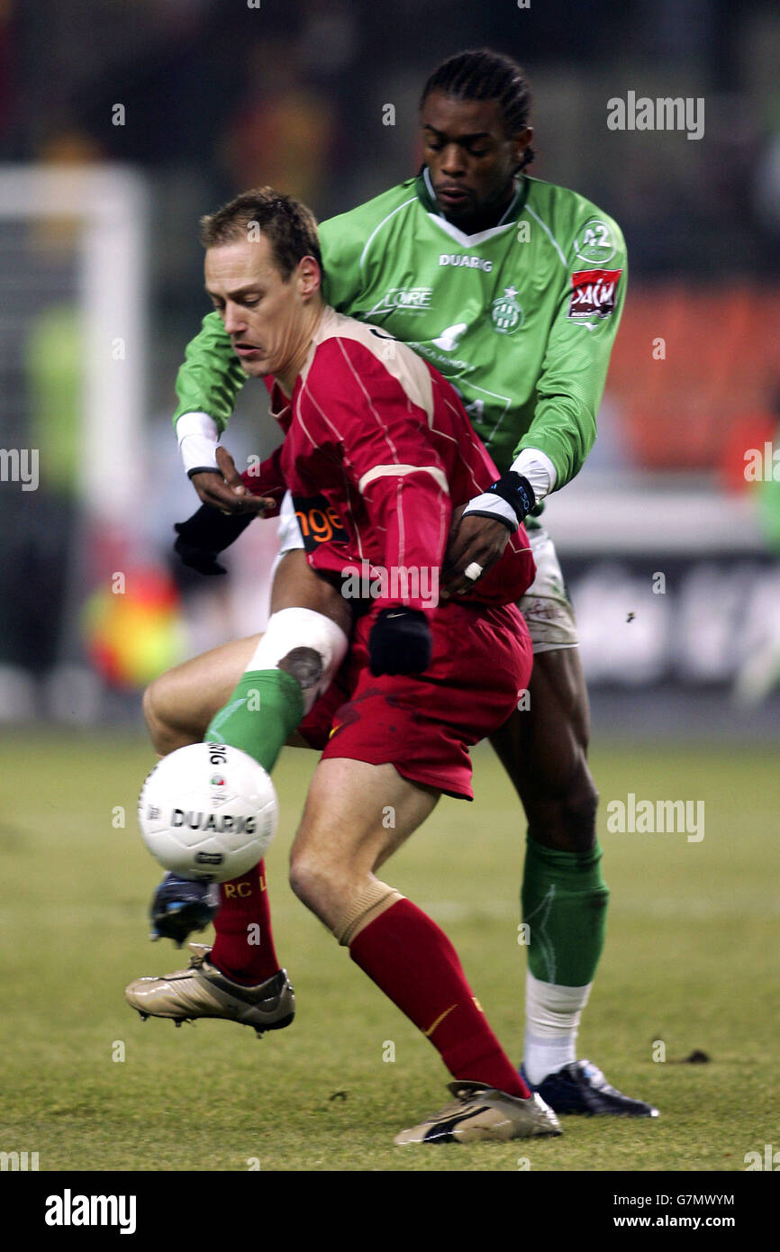 St Etienne's Frederic Piquionne and Lens' Nicolas Gillet (front) battle ...