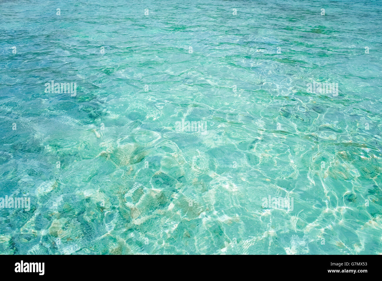 Crystal clear blue water in tropical lagoon for texture or background ...