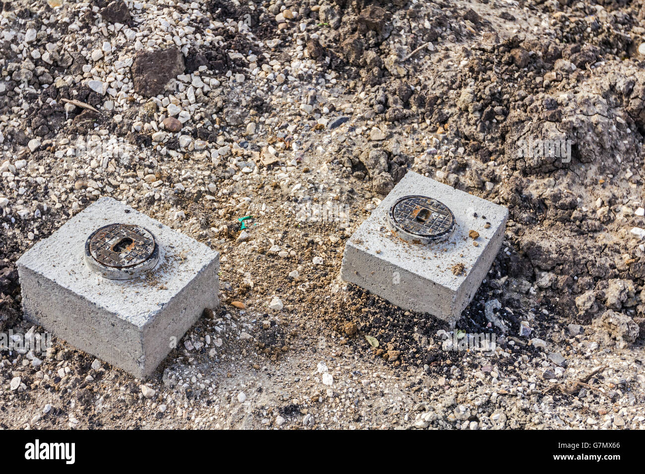 Round water metal hatch on square cement manhole are picking from the ...