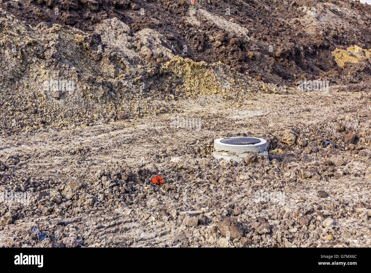 Round metal hatch on round cement manhole are picking from the ground ...