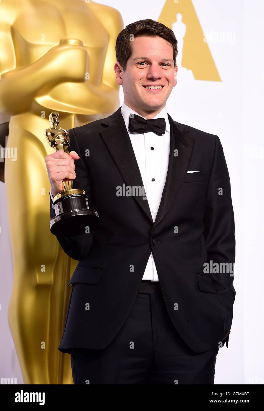 Graham Moore with the award for the best adapted screenplay for 'The ...