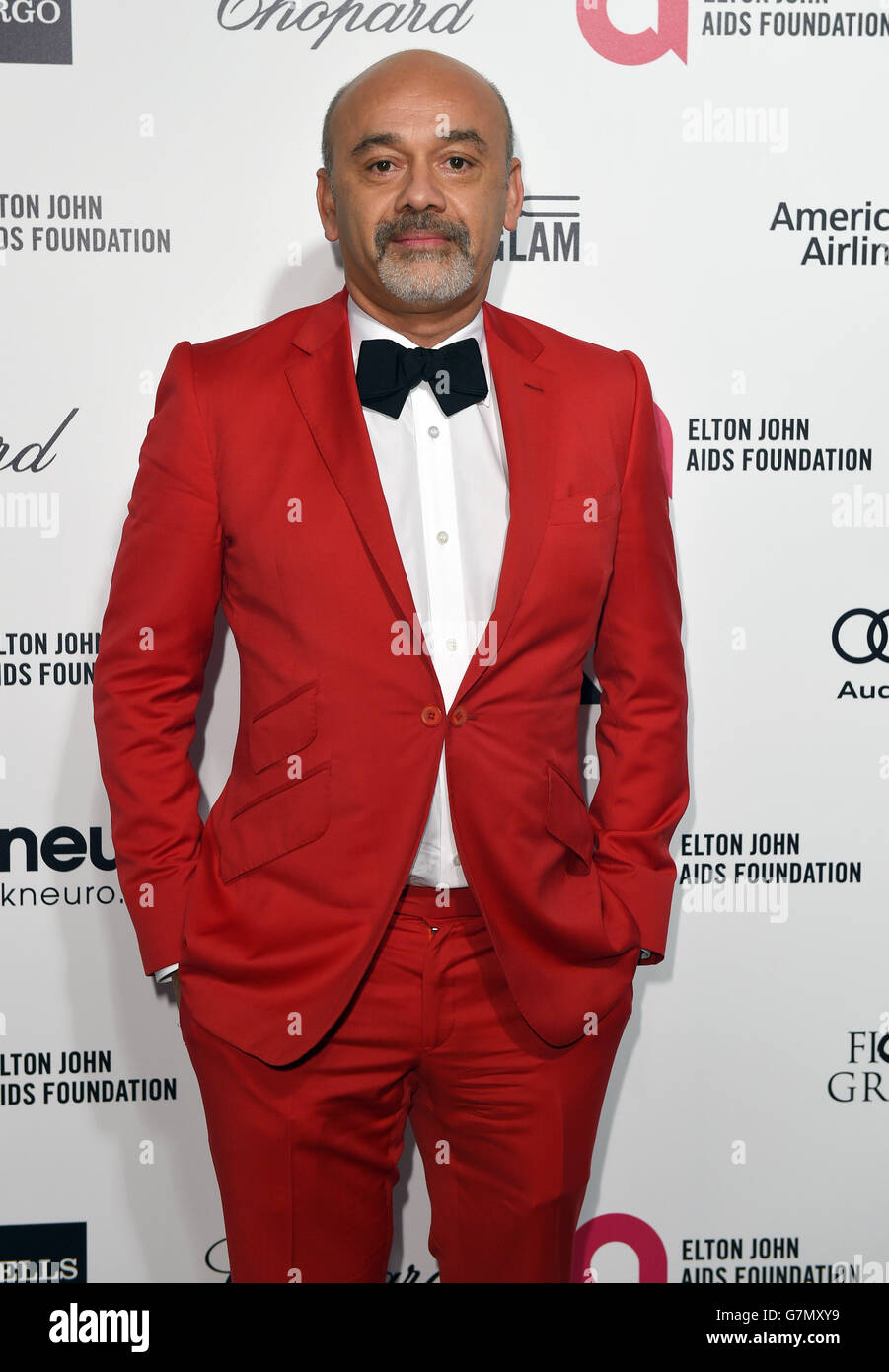 Christian Louboutin arrives for the Elton John AIDS Foundation's 23rd ...