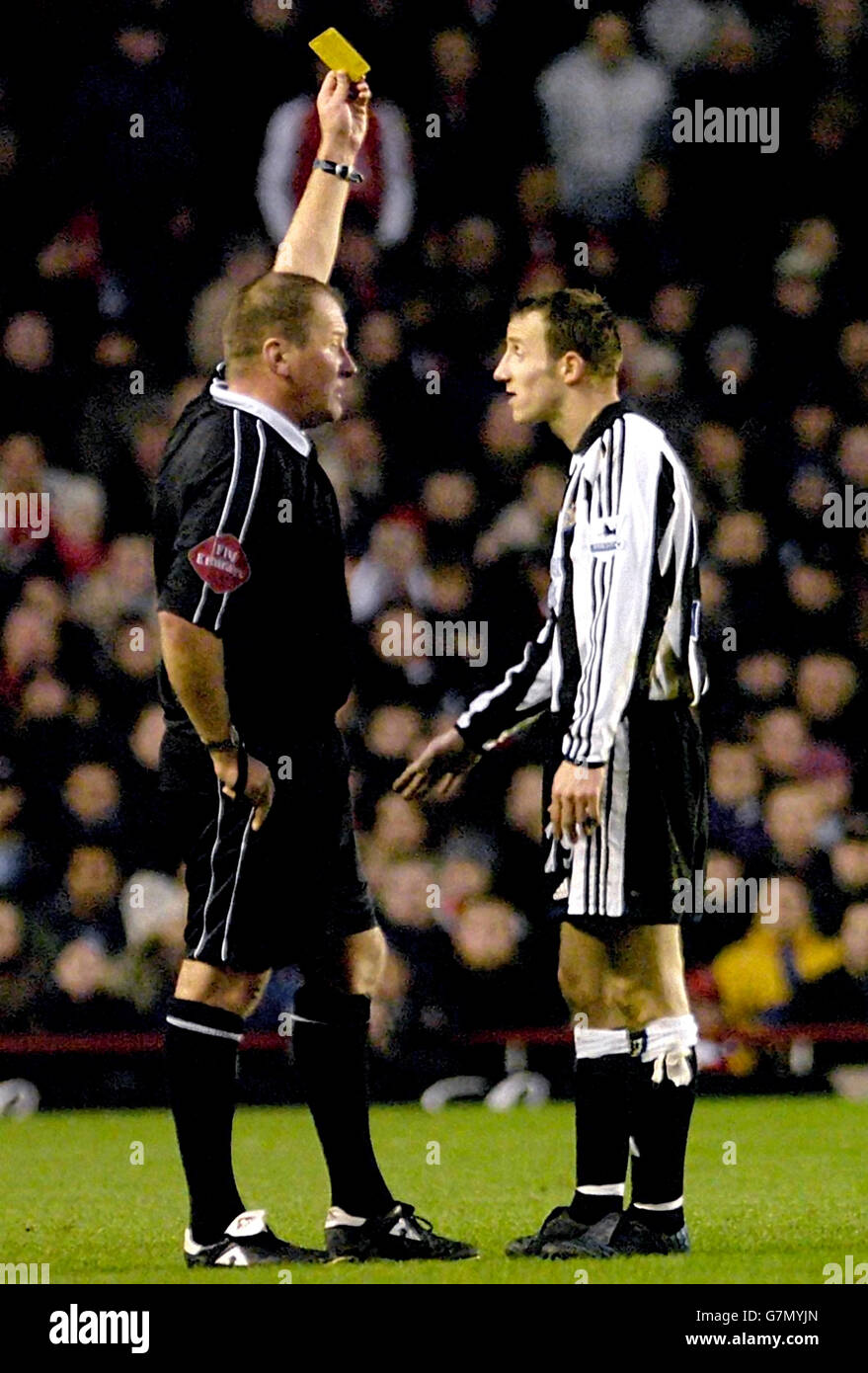 Newcastle uniteds lee right is by match referee steve dunn hi-res stock ...