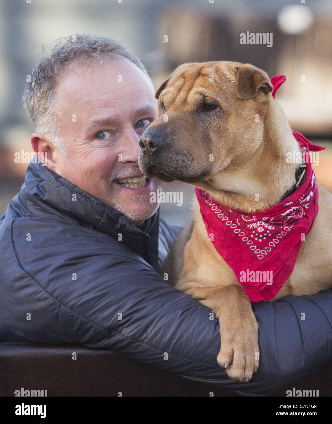Kai the dog with his new owner Ian Russell at a Scottish SPCA office in ...