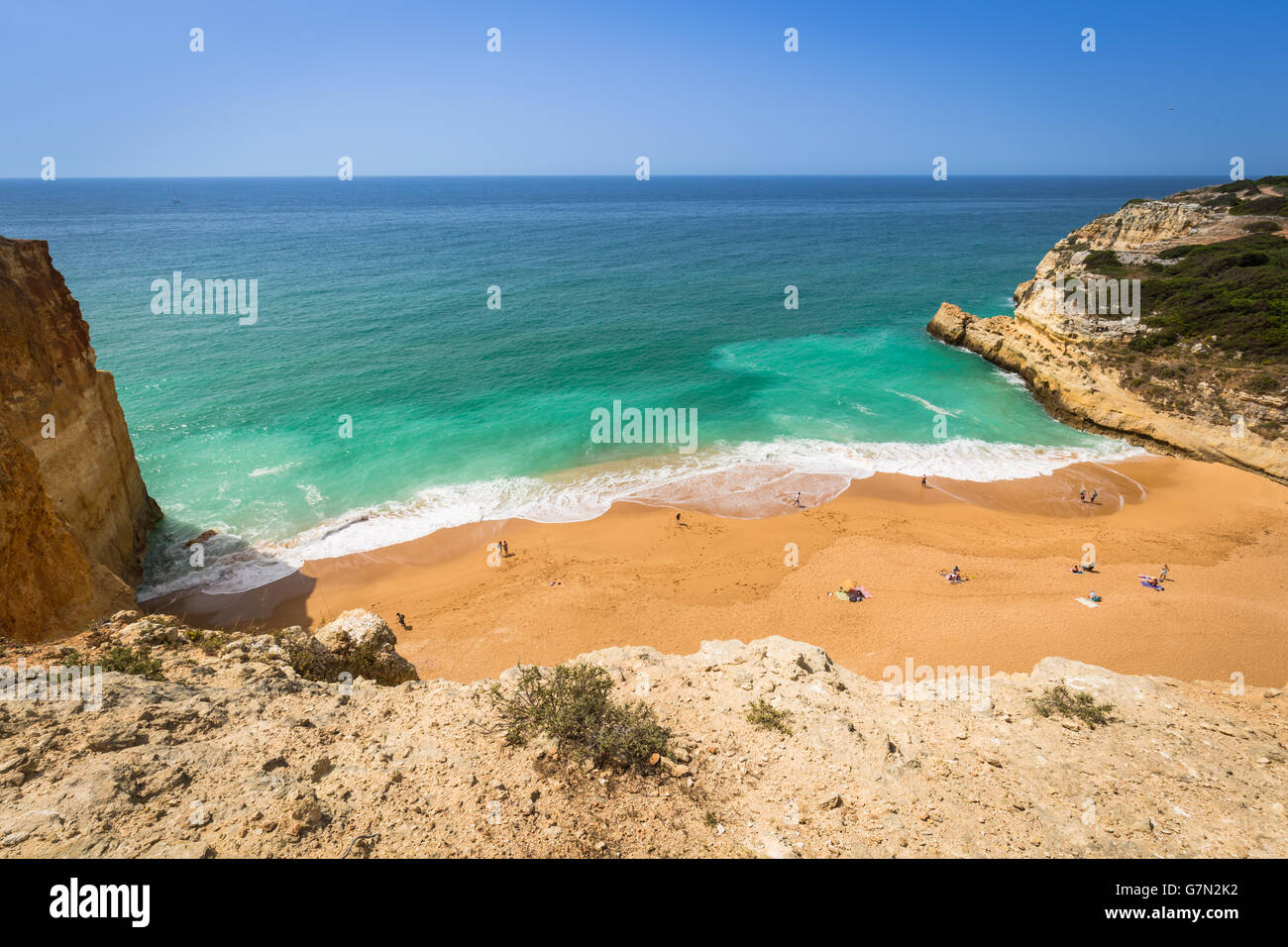A view of beach in Benagil fishing village on coast of Portugal Stock ...