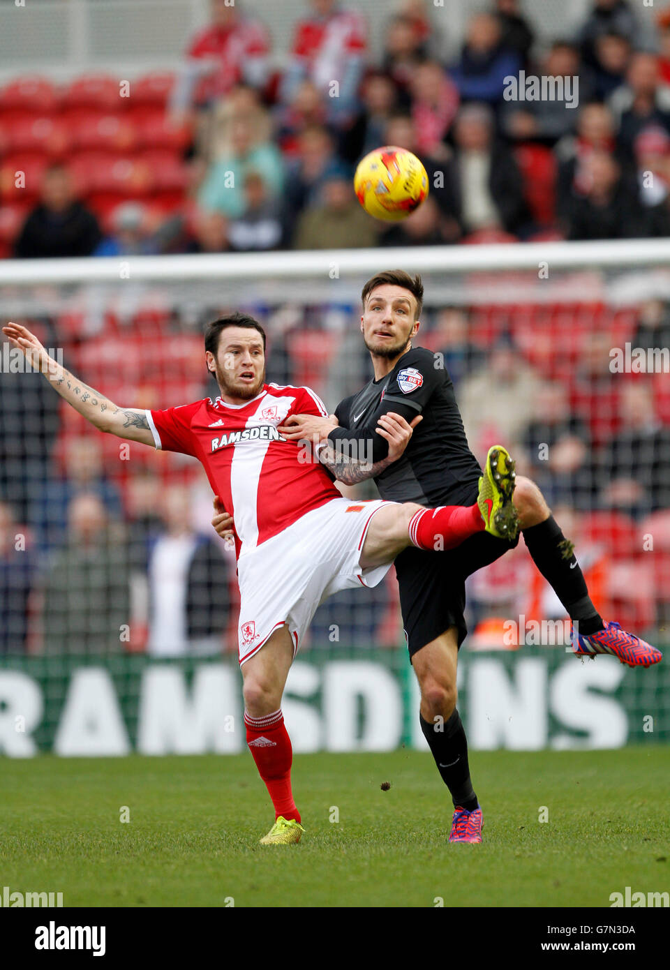 Middlesbrough's Lee Tomlin challenges Charlton's Morgan Fox to the ball ...