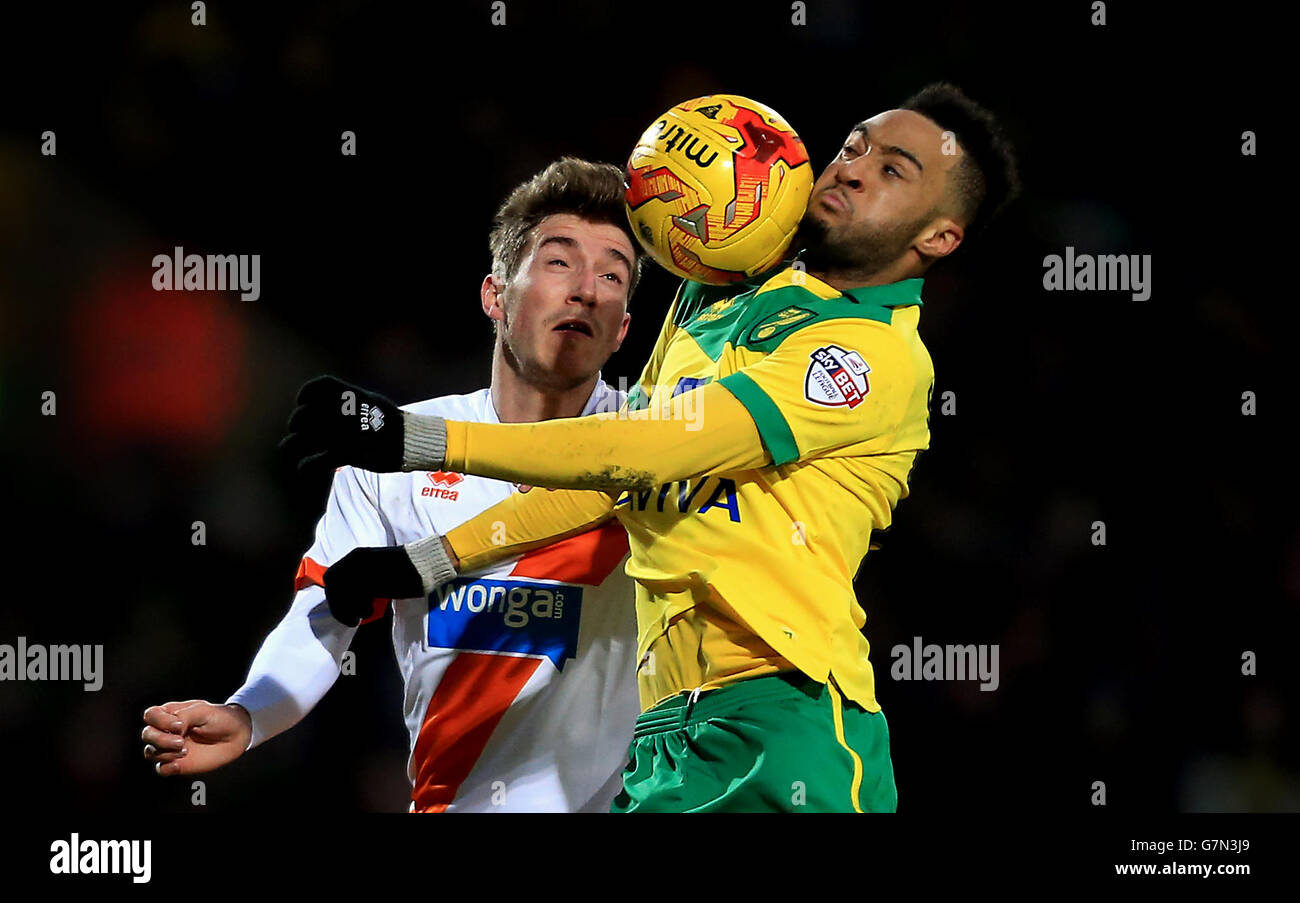 Norwich City's Nathan Redmond and Blackpool's Joe Rothwell compete for ...