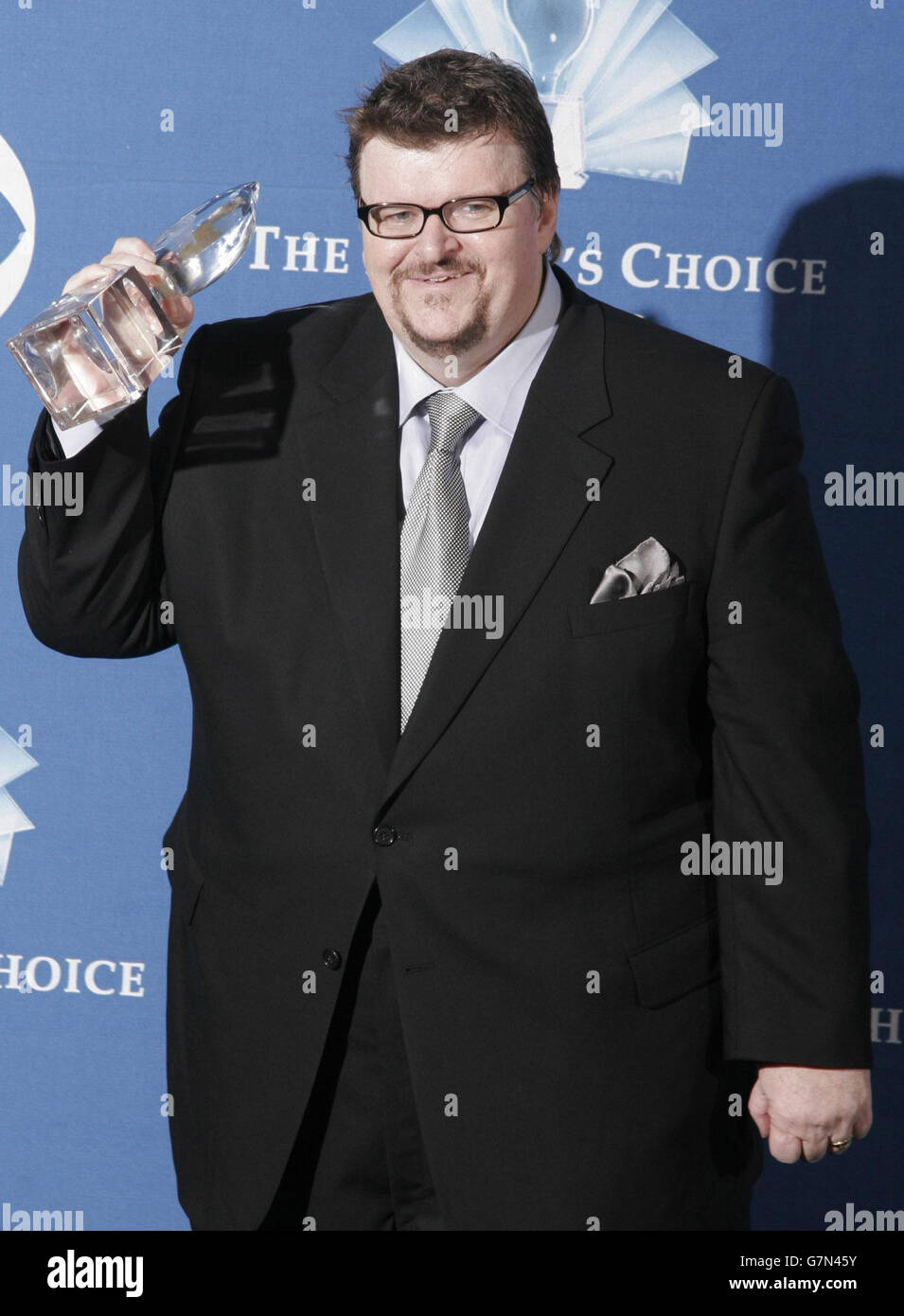 Director Michael Moore with his award for Favourite Movie 'Fahrenheit 9 ...