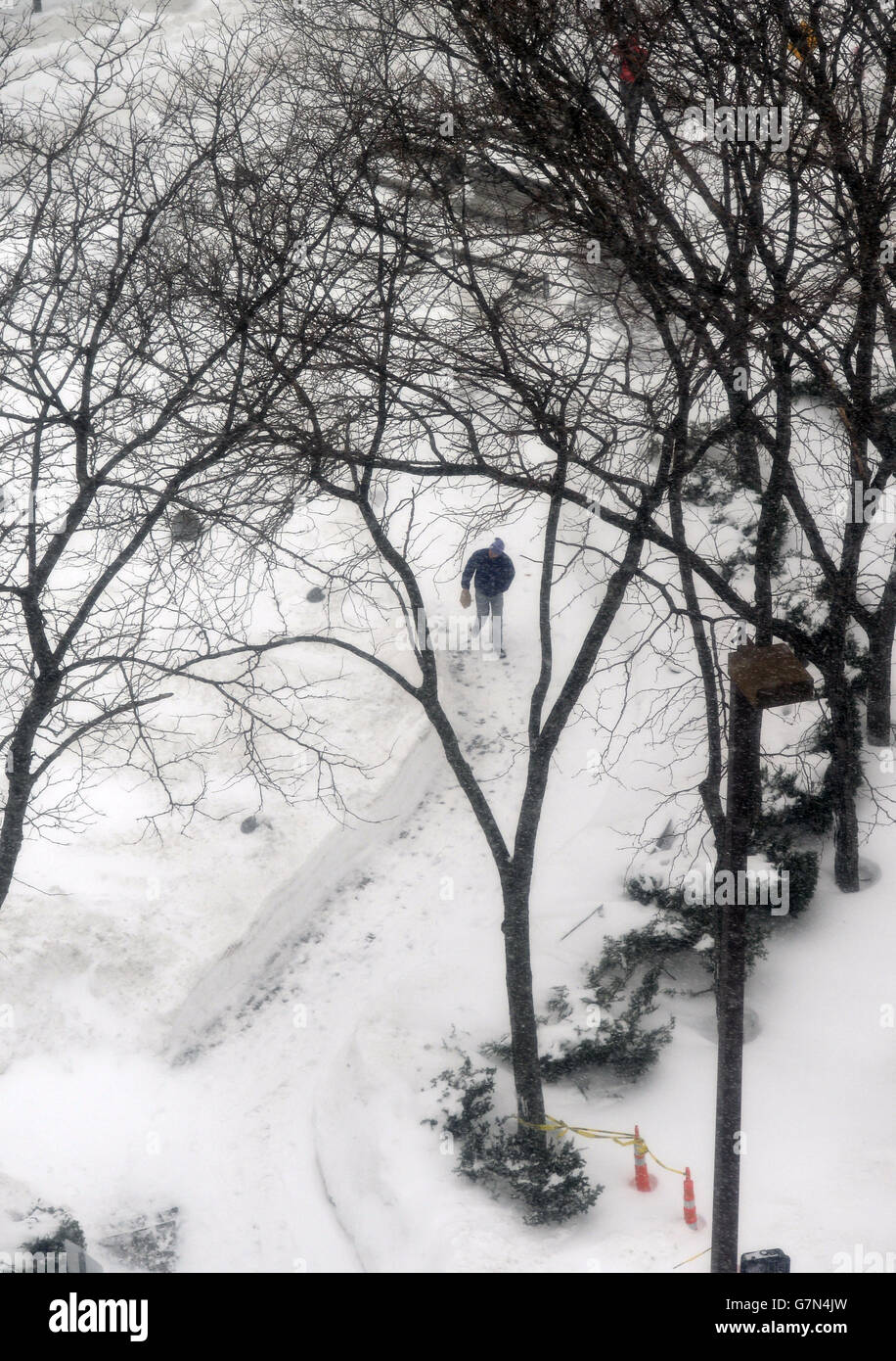 People make their way through deserted streets in Boston as the ...