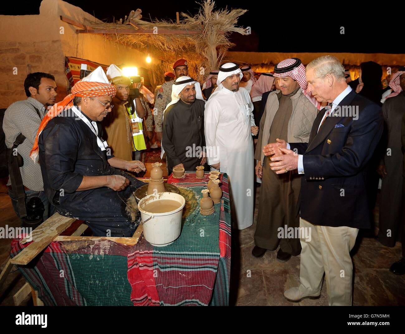 The Prince of Wales watches a traditional potter in the old town of Al ...