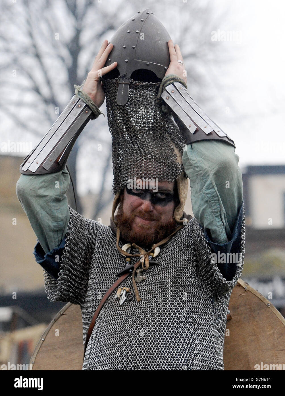 Viking re enactor prepares for battle during the jorvik viking festival ...