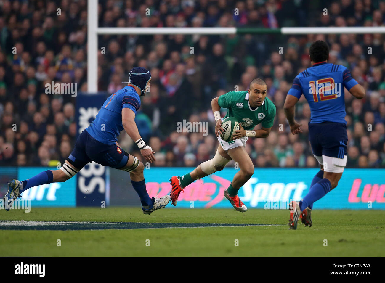Ireland's Simon Zebo (centre) takes on France's Bernard Le Roux (left ...