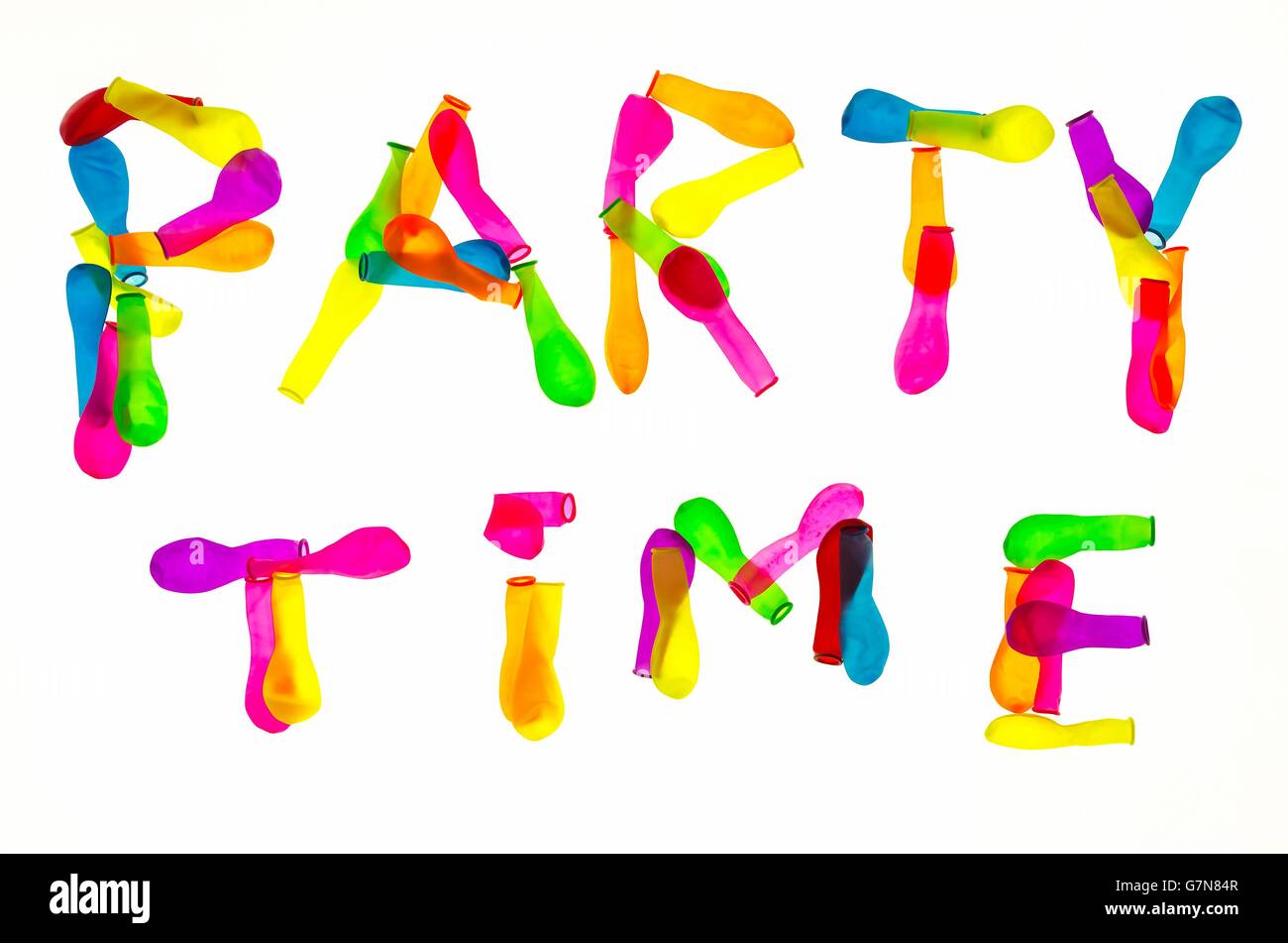 deflated colored balloons , on white background, used to make words ...