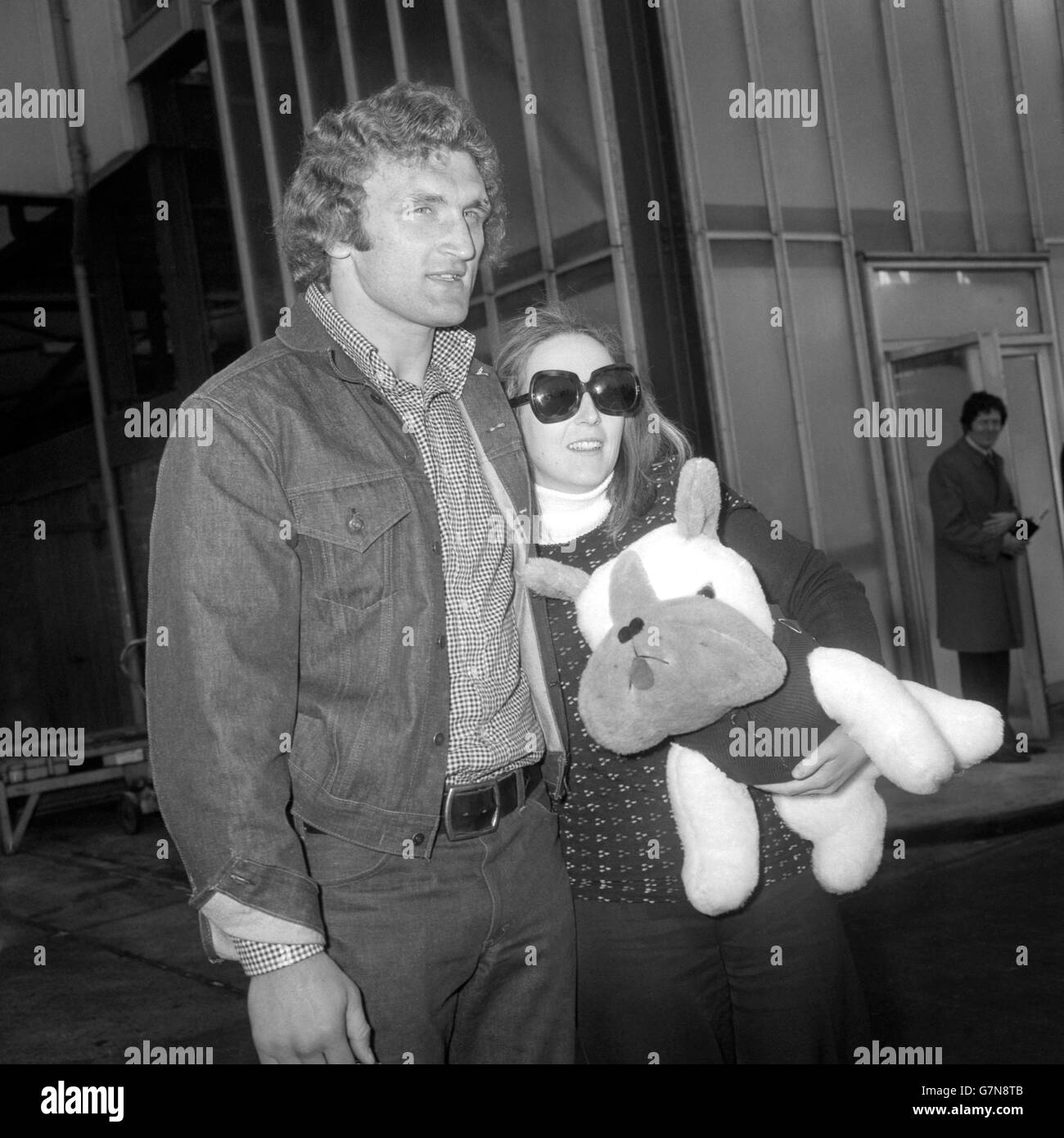 Mrs Melody Bugner, snuggles up to her boxer husband Joe, on arrival at ...
